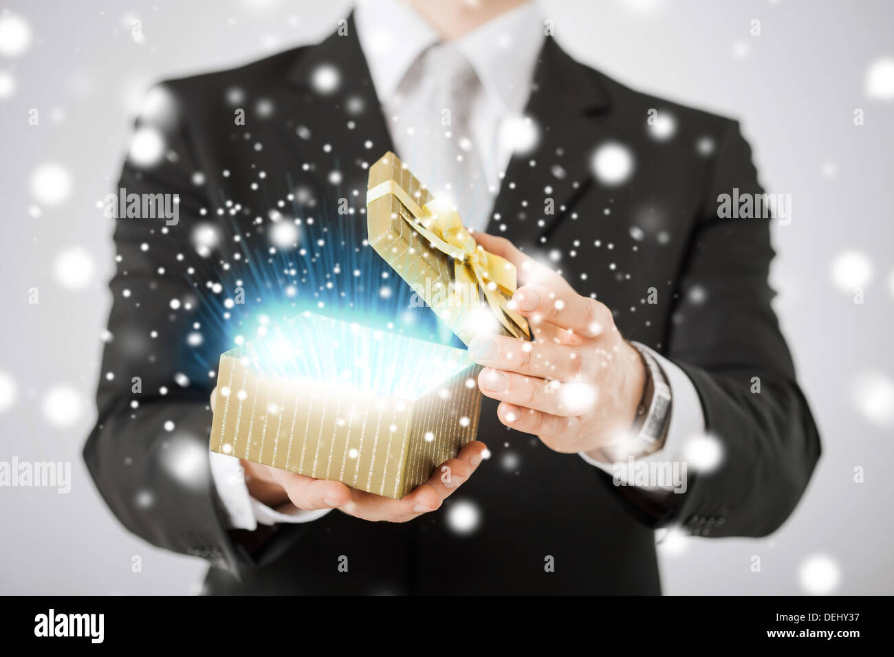 man opening gift box Stock Photo - Alamy