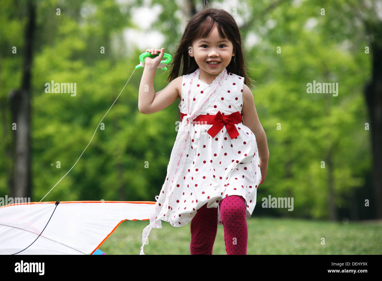A girl playing outside Stock Photo - Alamy
