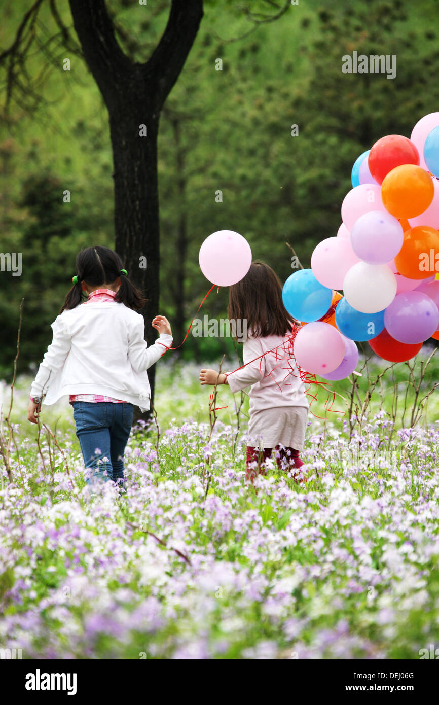 Child holding balloon full sunlight hi-res stock photography and images ...