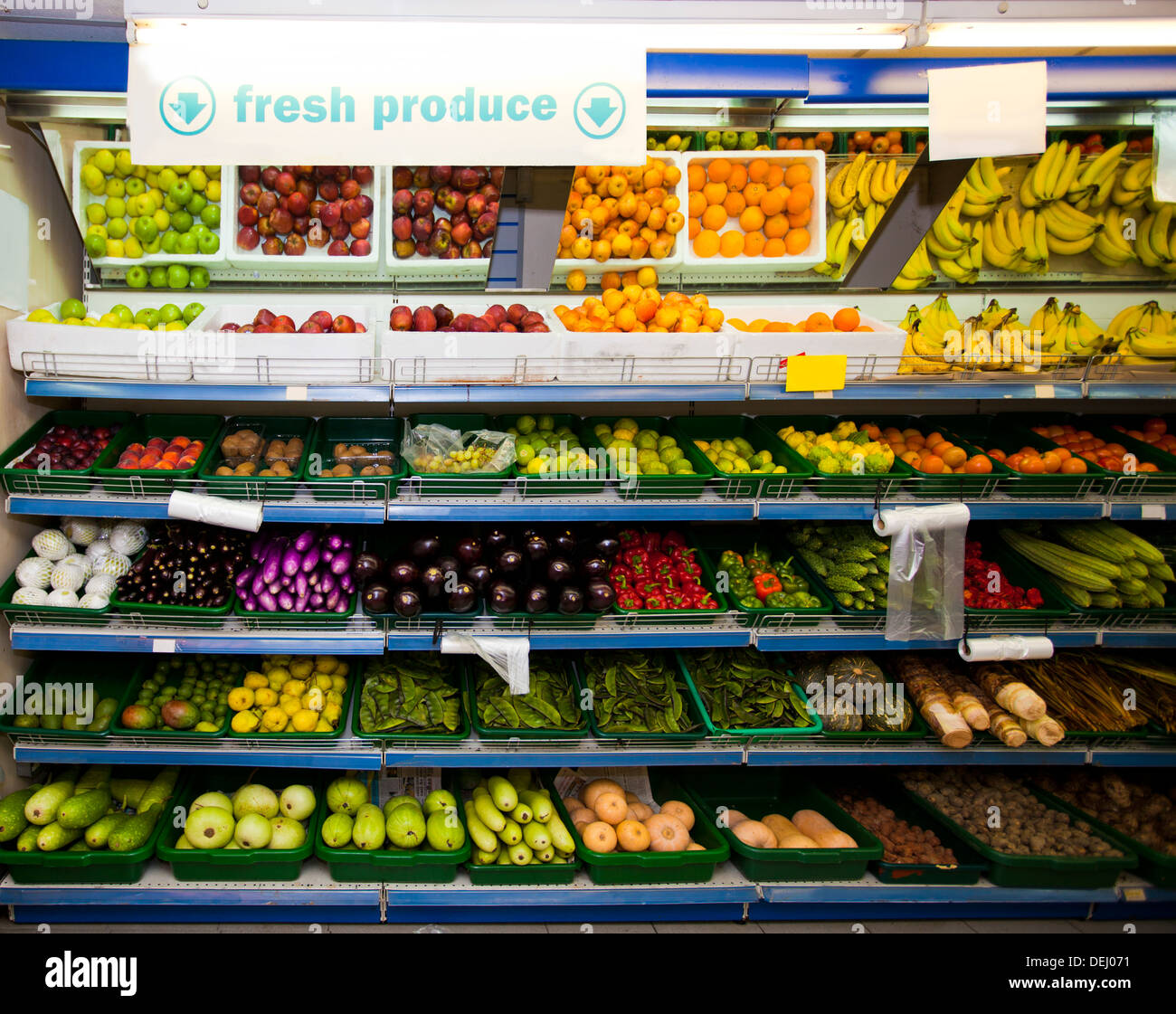 Various vegetables fruits on display grocery store Stock Photo - Alamy