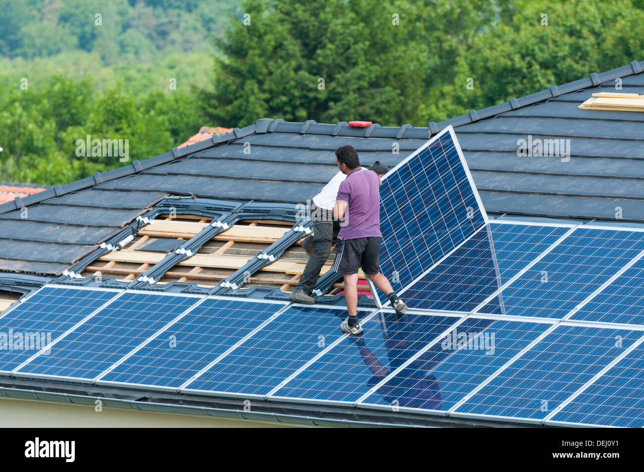 Installation of photovoltaic solar panels on roof of house, Germany ...