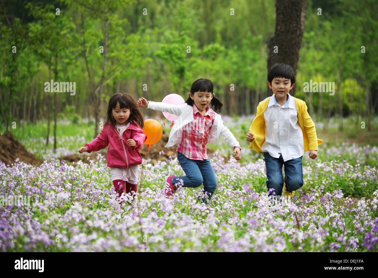 Oriental children playing outdoors Stock Photo - Alamy