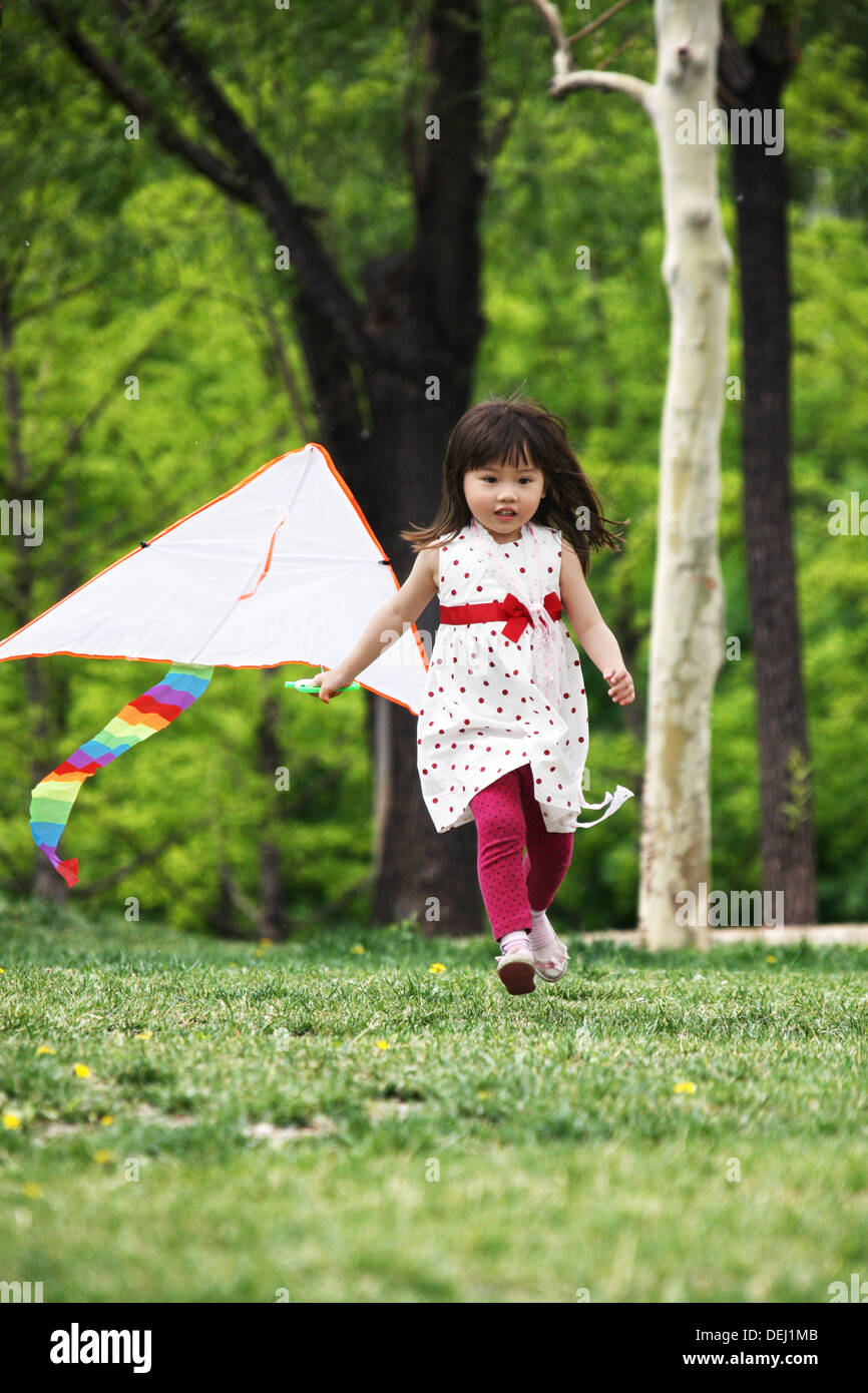 A girl playing outside Stock Photo - Alamy