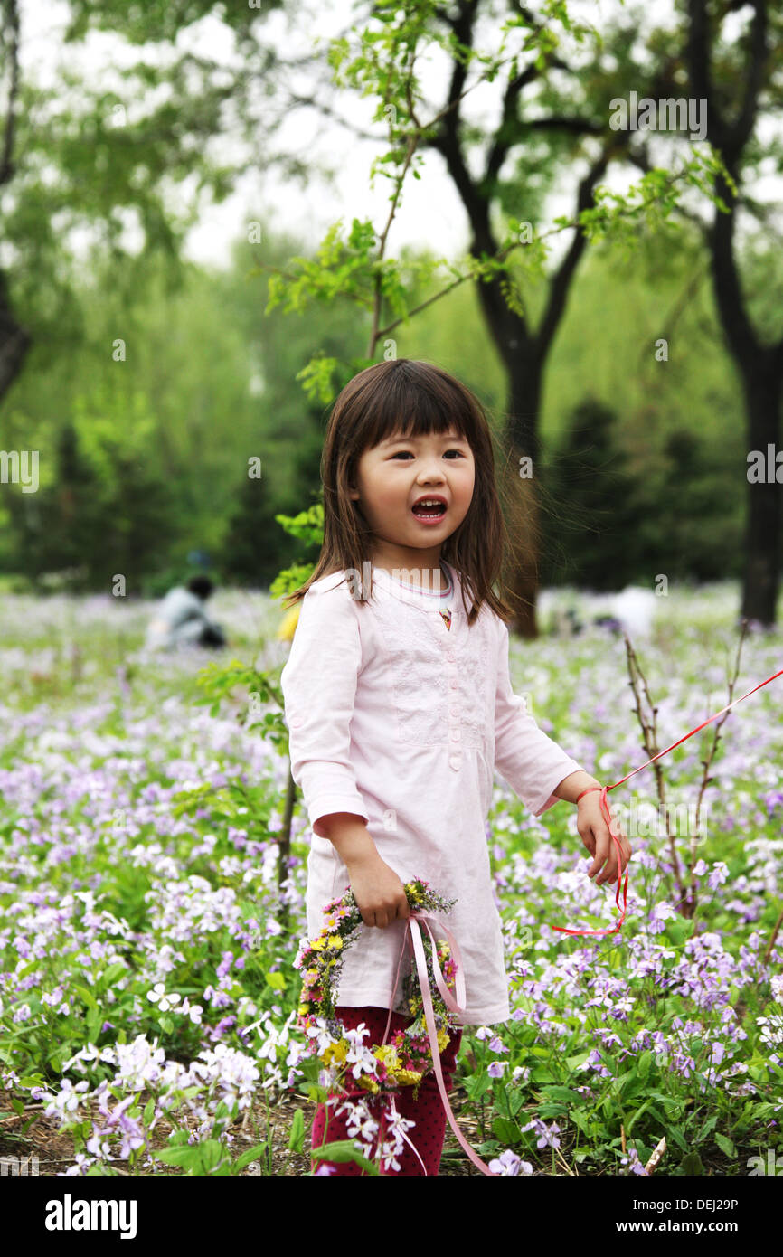 A girl playing outside Stock Photo - Alamy