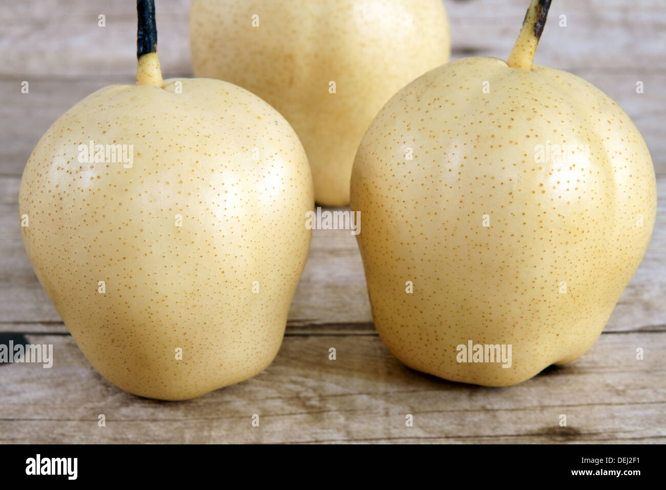 Chinese Ya Pears on a wooden background Stock Photo - Alamy
