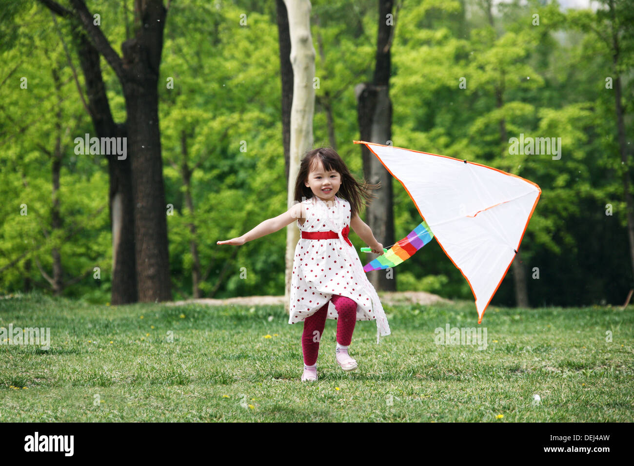 A girl playing outside Stock Photo - Alamy