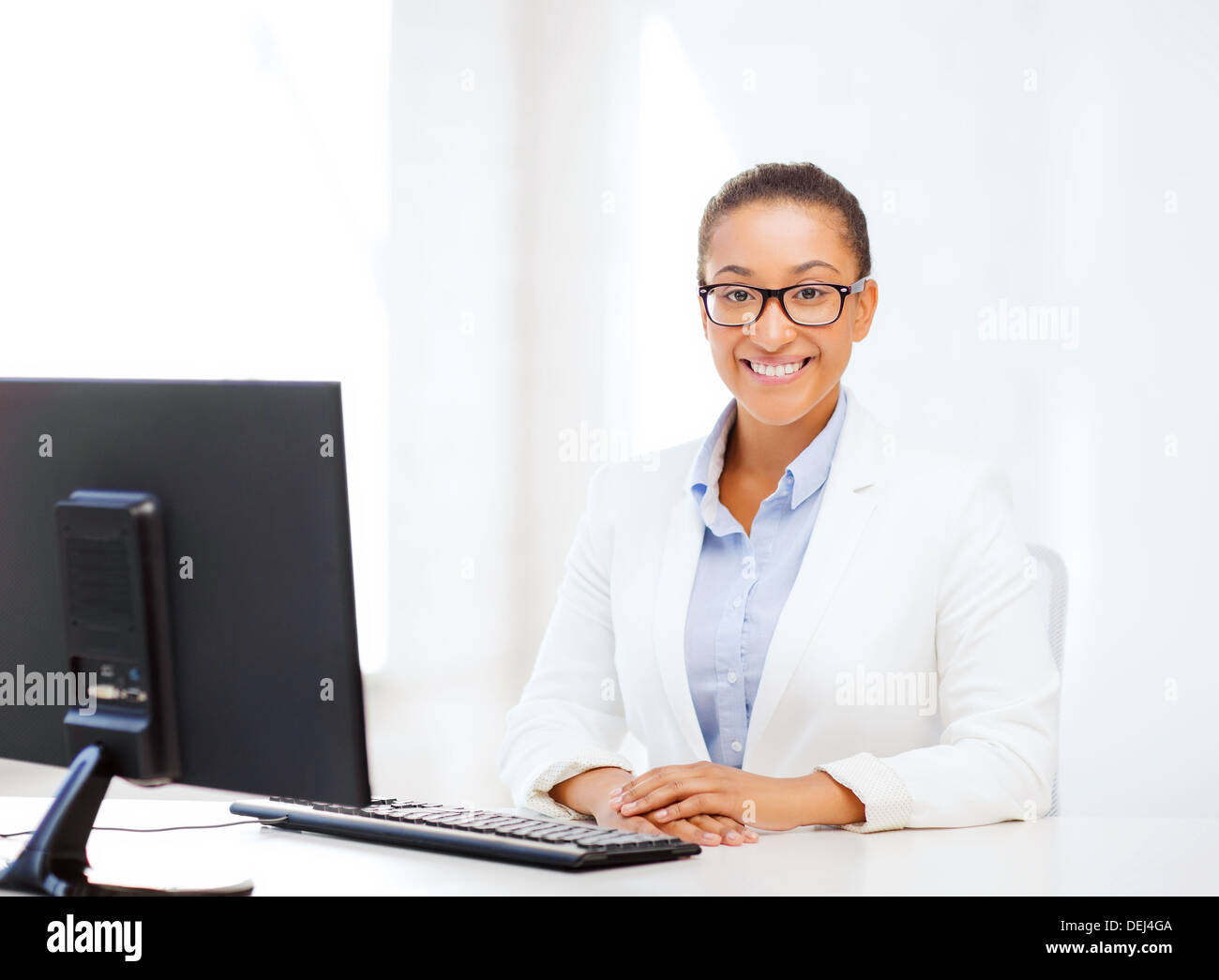 african businesswoman with computer in office Stock Photo - Alamy