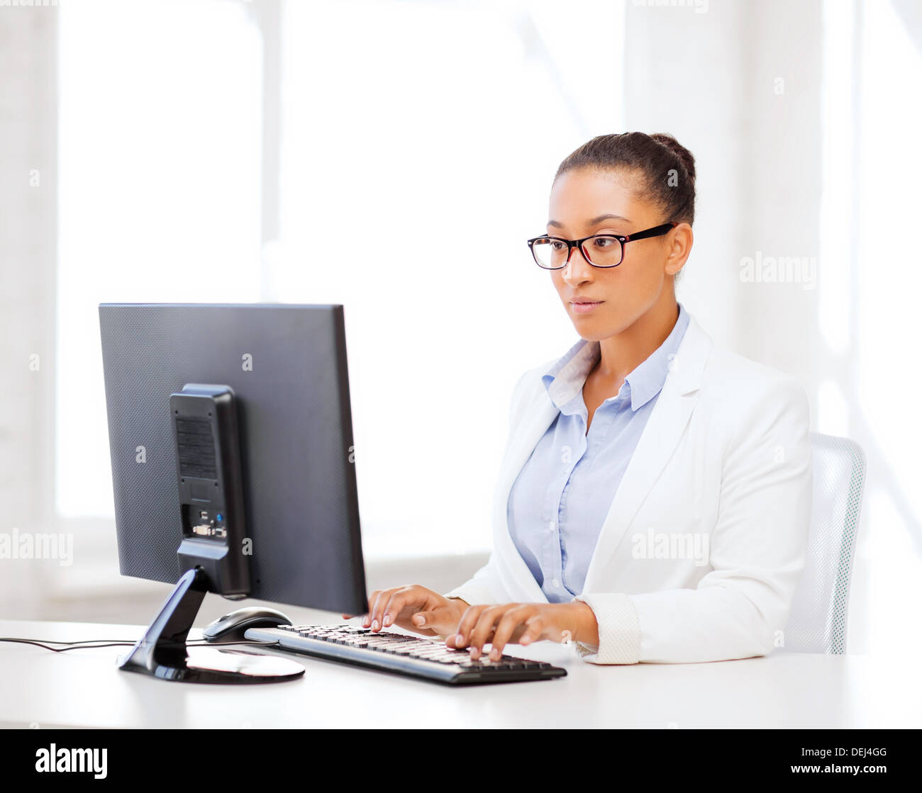 african businesswoman with computer in office Stock Photo - Alamy