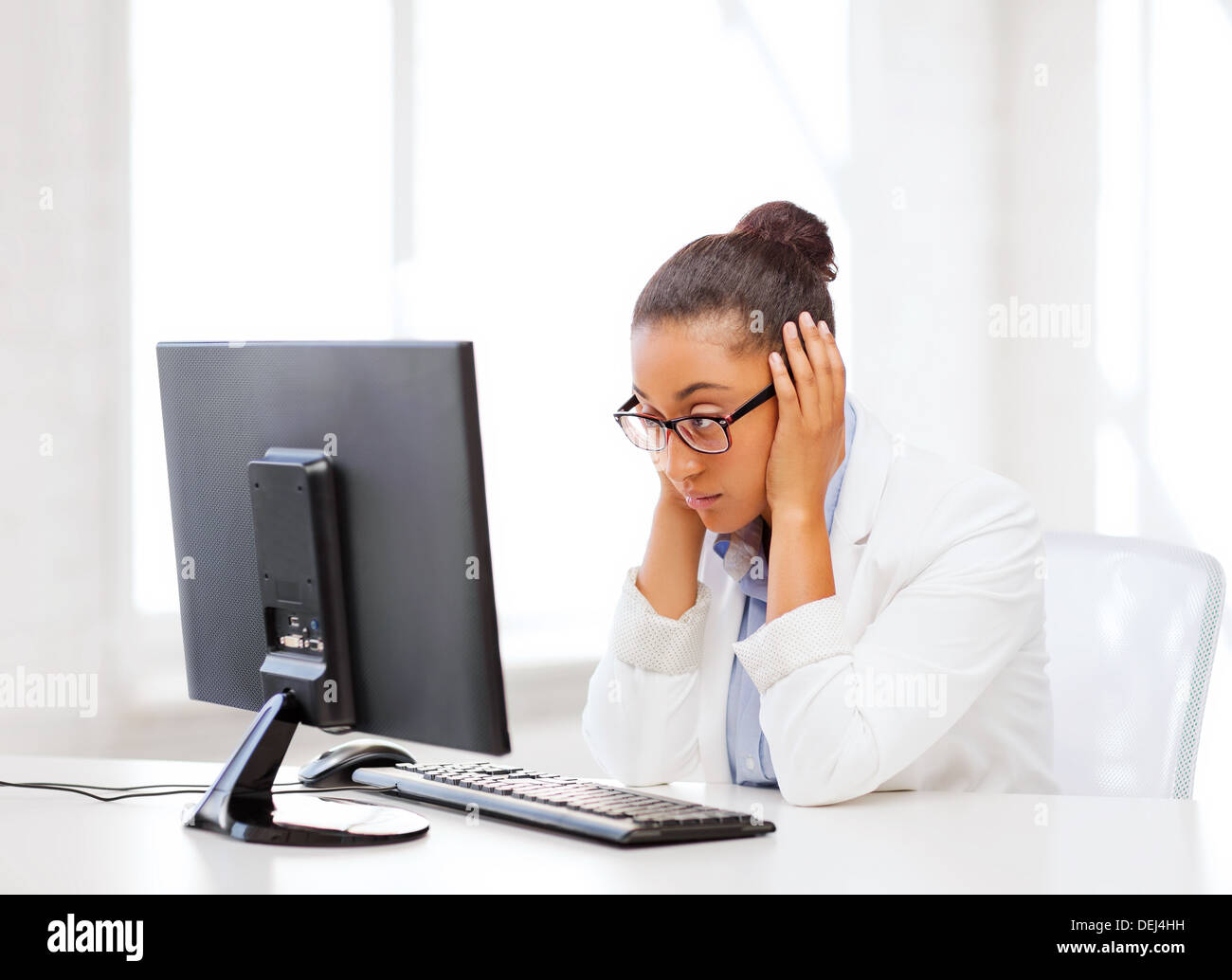 stressed african woman with computer Stock Photo - Alamy