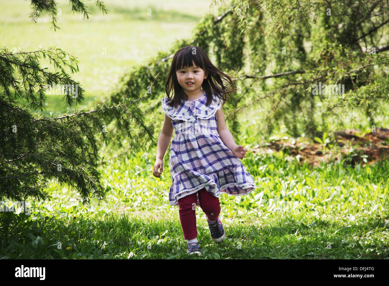 A girl playing outside Stock Photo - Alamy