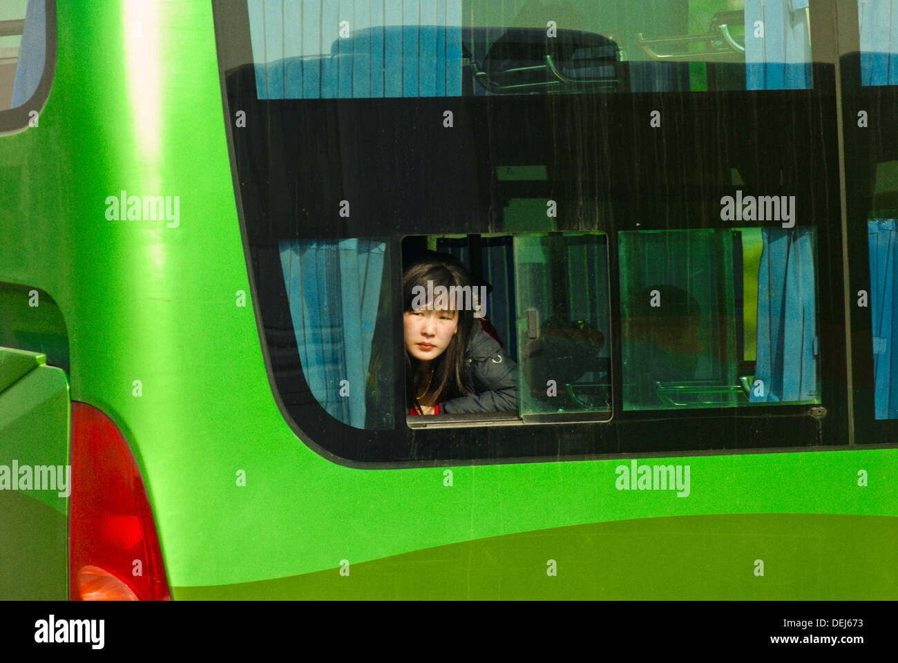 Woman Looking Out Of A Bus Window High Resolution Stock Photography and ...