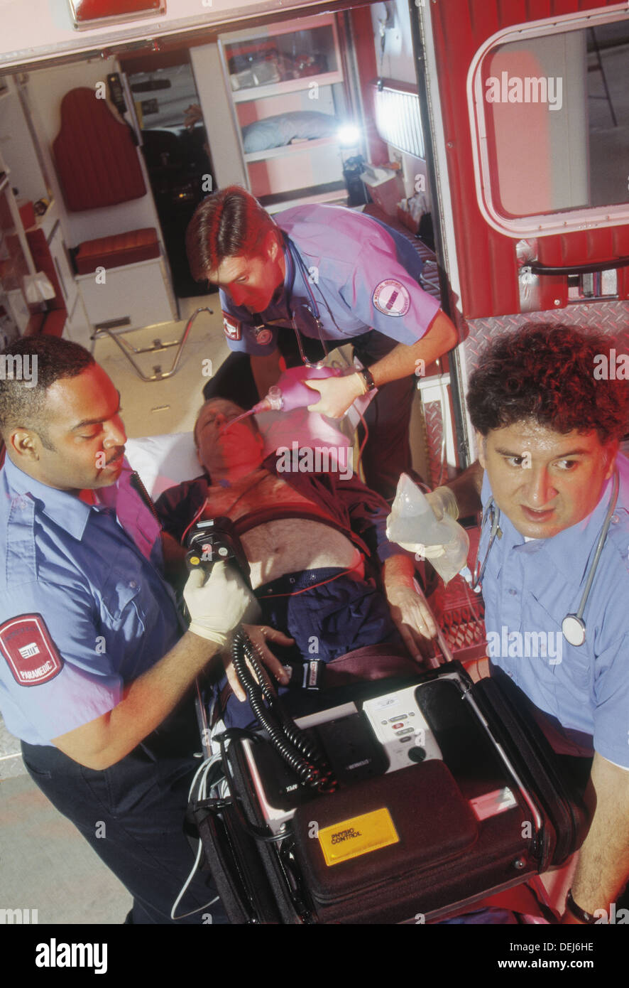 Paramedics rushing patient from ambulance to emergency in hospital ...