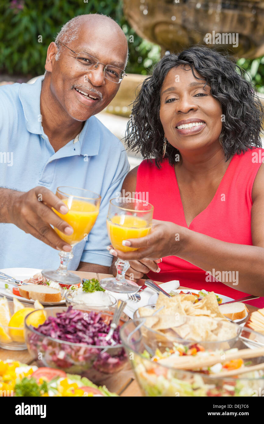 Happy Smiling Man And Woman Senior African American Couple Drinking