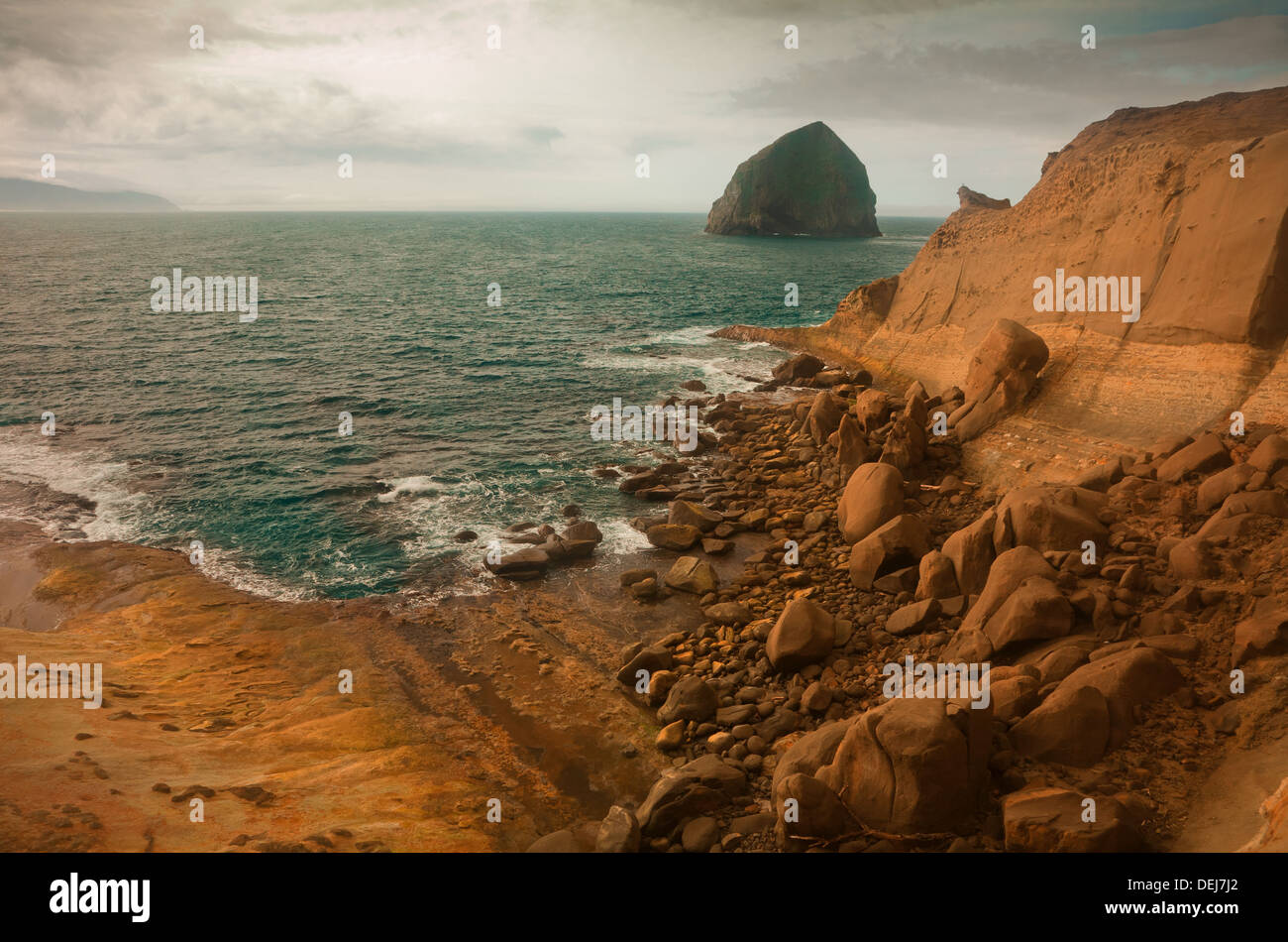 OREGON - Sandstone cliffs at Cape Kiwanda with view of Haystack Rock on ...