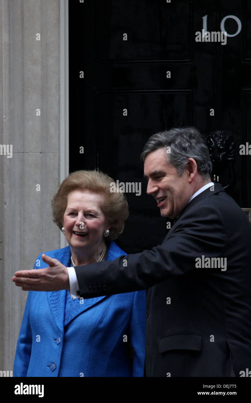 Prime Minister Gordon Brown helps Lady Thatcher down the step of Number ...