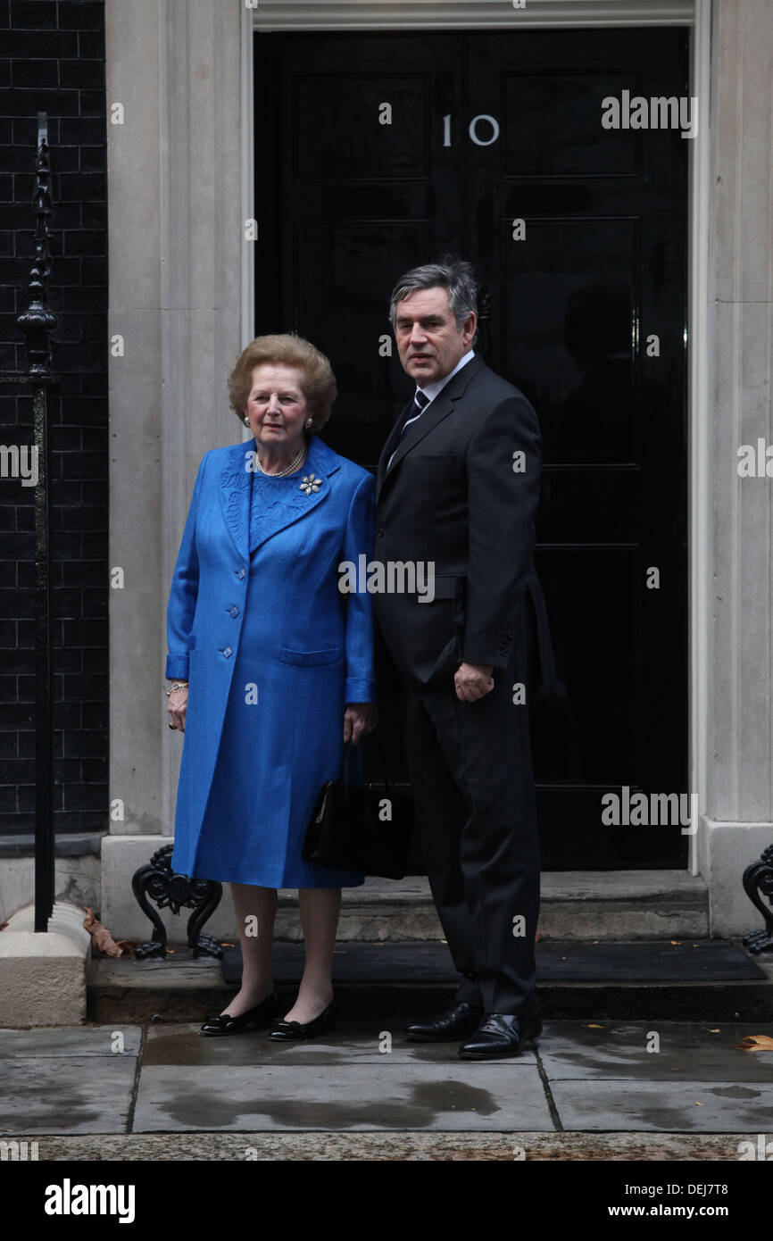 Prime Minister Gordon Brown helps Lady Thatcher down the step of Number ...