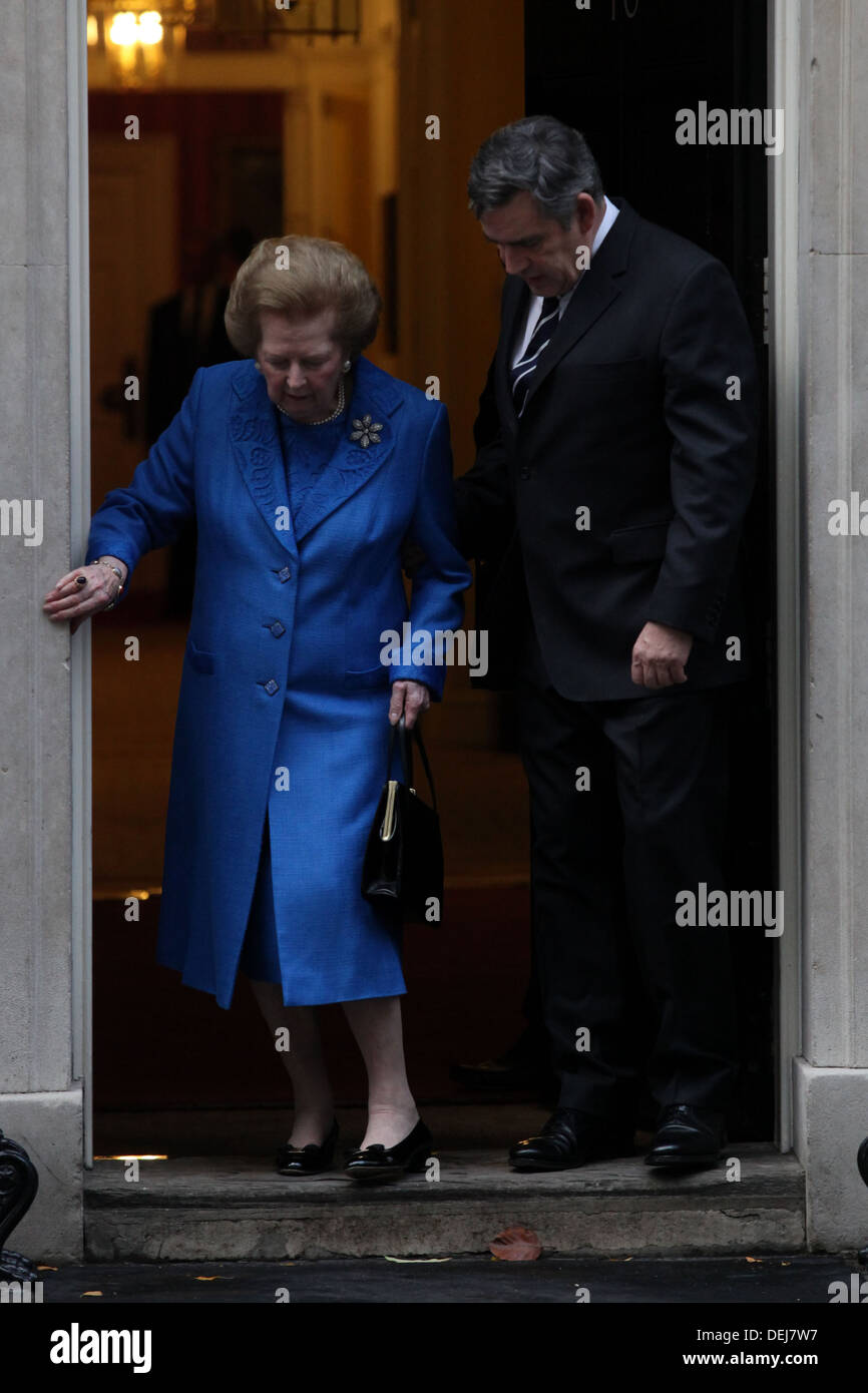 Prime Minister Gordon Brown helps Lady Thatcher down the step of Number ...