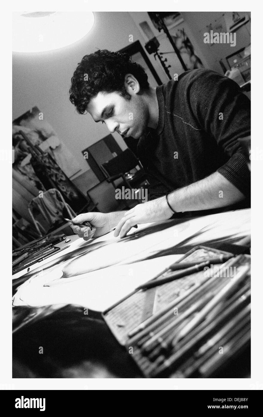 Man sitting at desk drawing Cut Out Stock Images & Pictures - Alamy