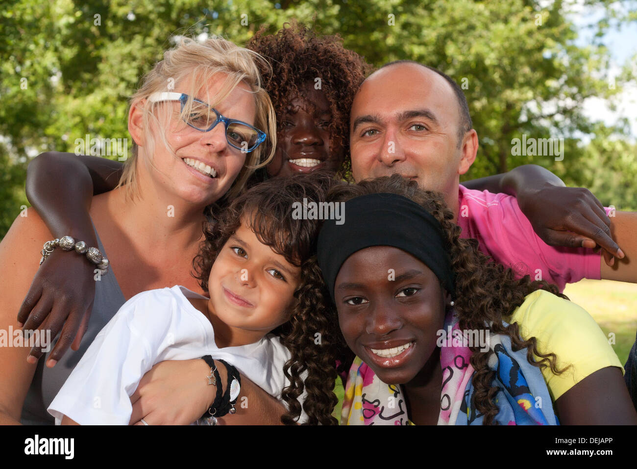 Happy multicultural family having a nice summer day Stock Photo - Alamy