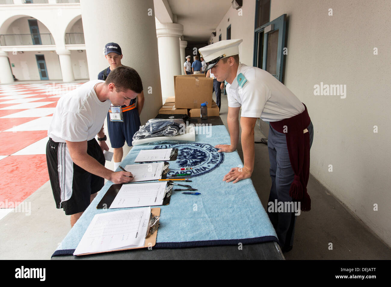 An incoming Citadel freshman known as a knob signs for newly issued ...
