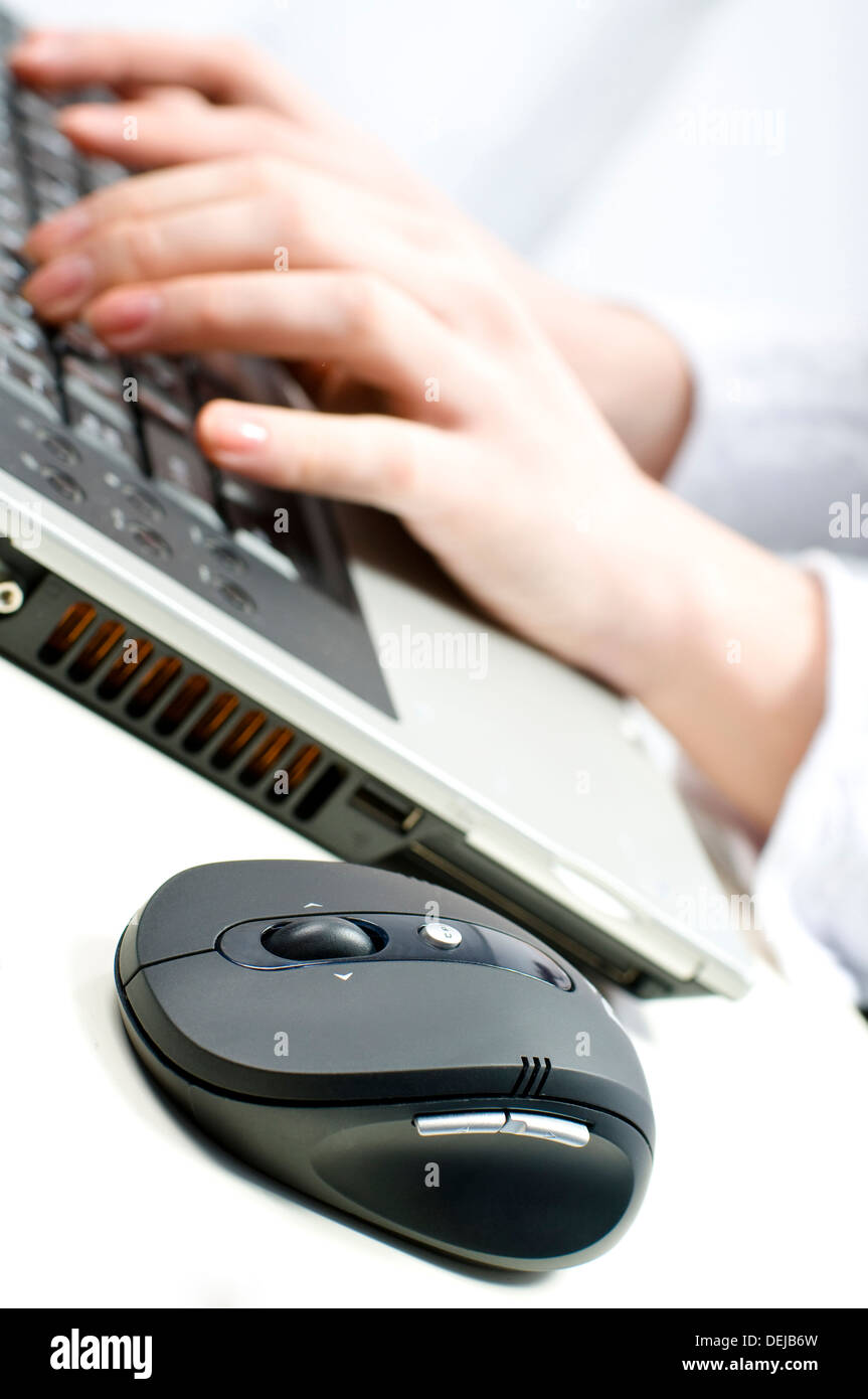 computer mouse and hands typing on keyboard Stock Photo - Alamy