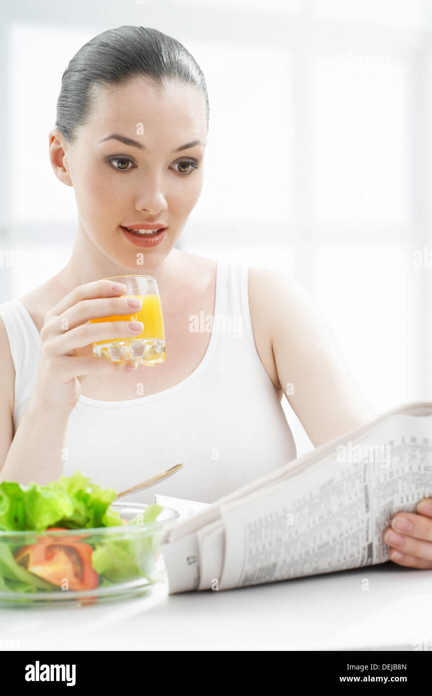 A beautiful slender girl eating healthy food Stock Photo - Alamy