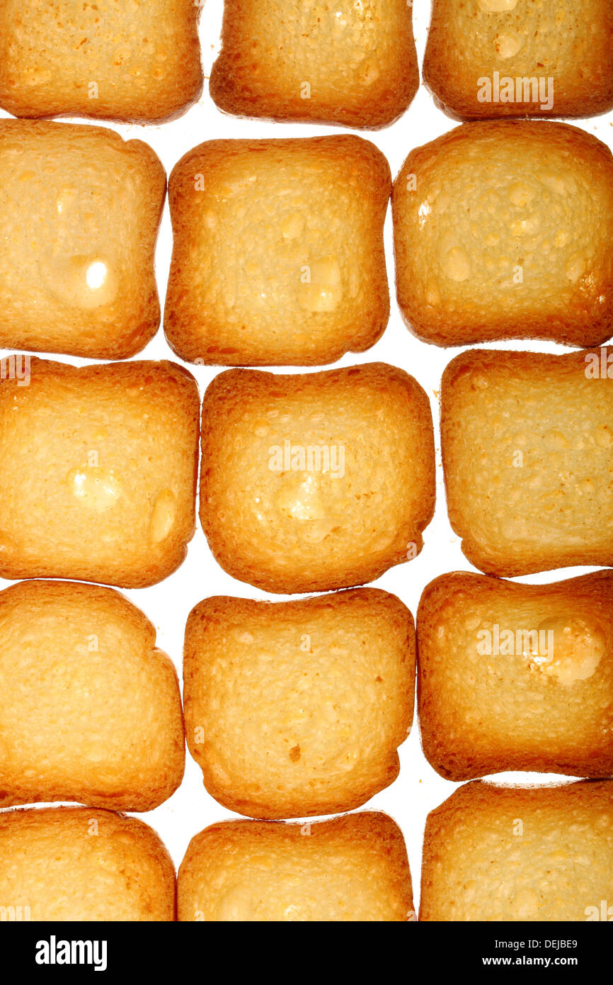 Many small dried rusks bread loaf toast biscuits as texture background ...