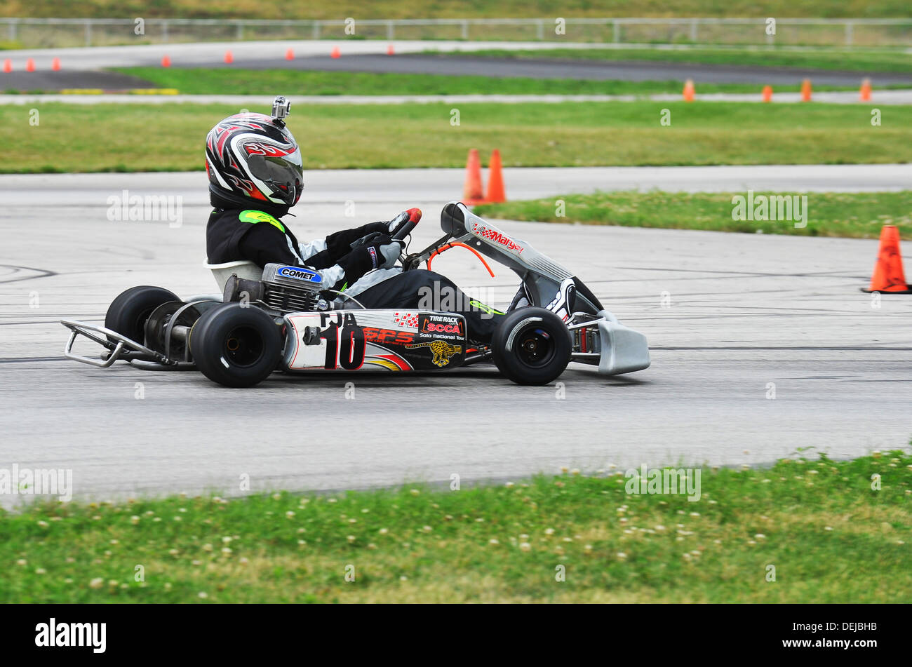 Teenage racer on a Yamaha engined sprint kart on a road racing circuit ...
