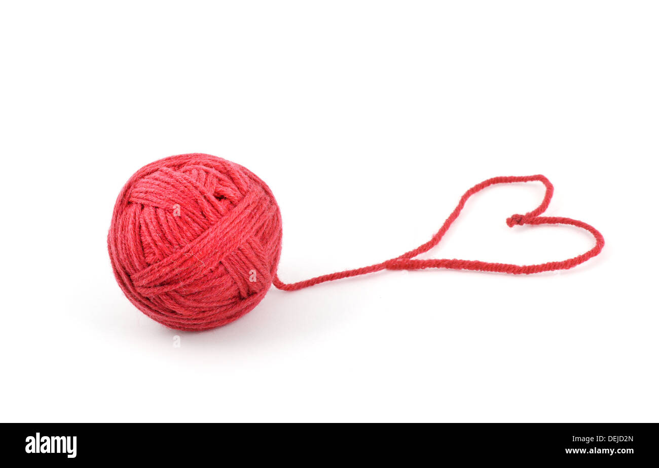 Thread ball with heart isolated on white background Stock Photo - Alamy