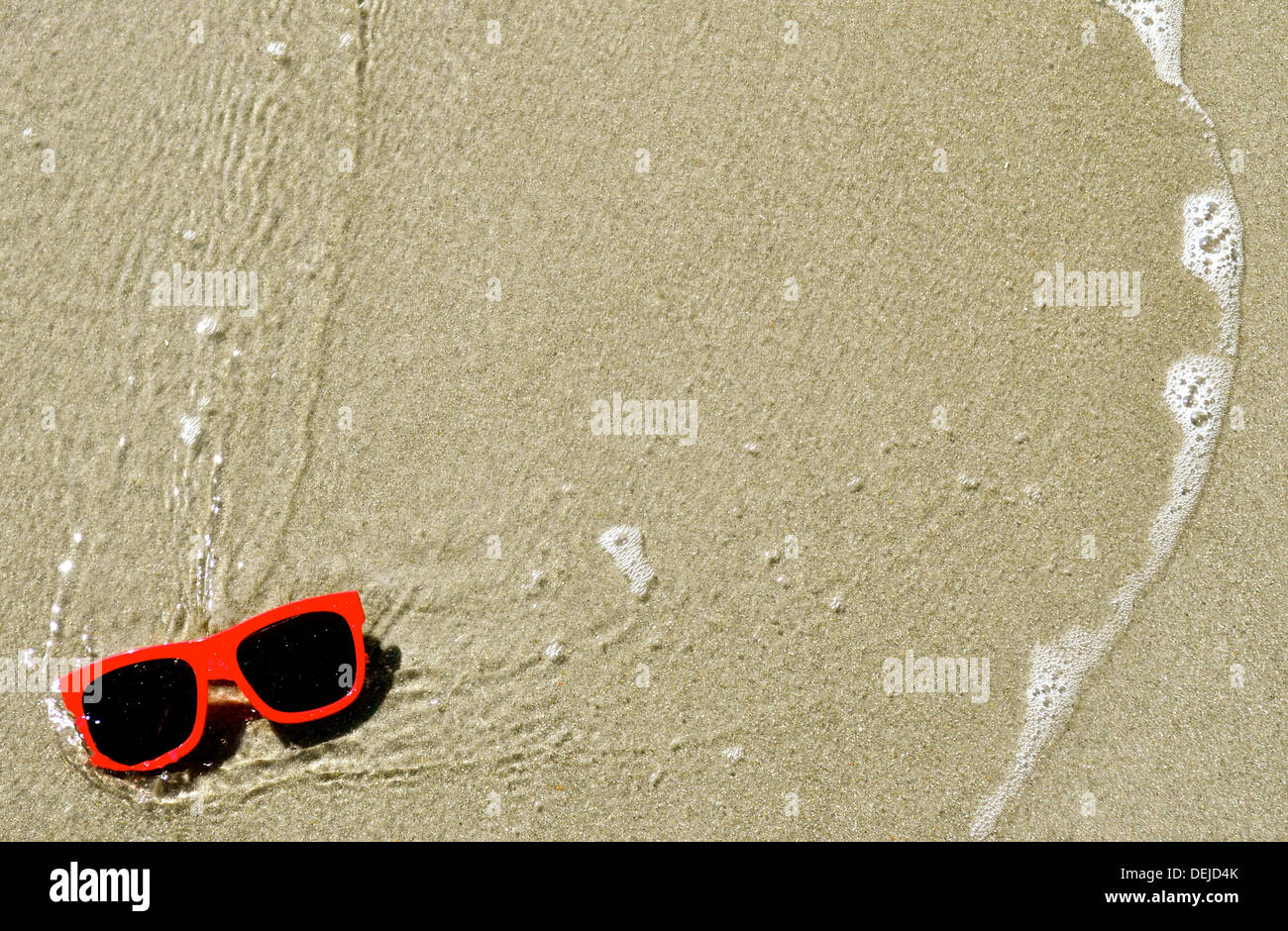 Sunglasses on the Beach Stock Photo - Alamy