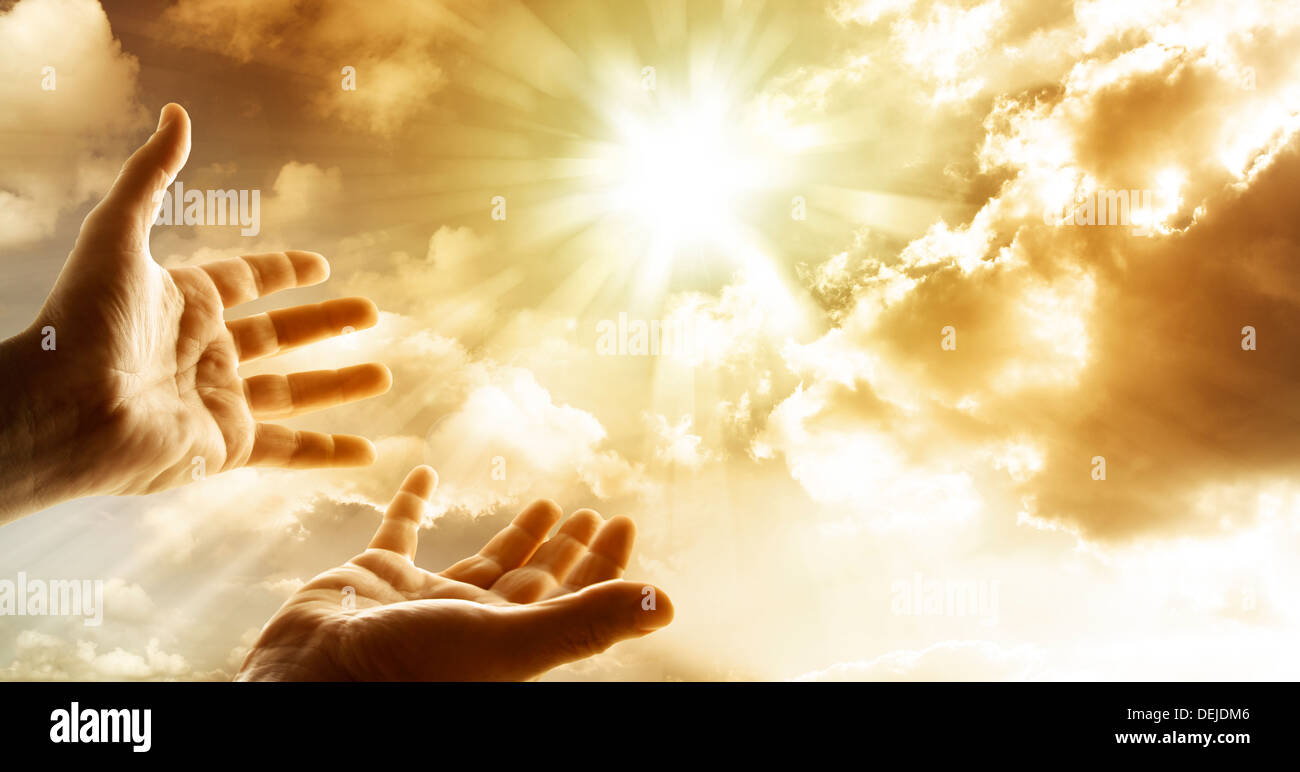 Hands reaching for the sky Stock Photo - Alamy