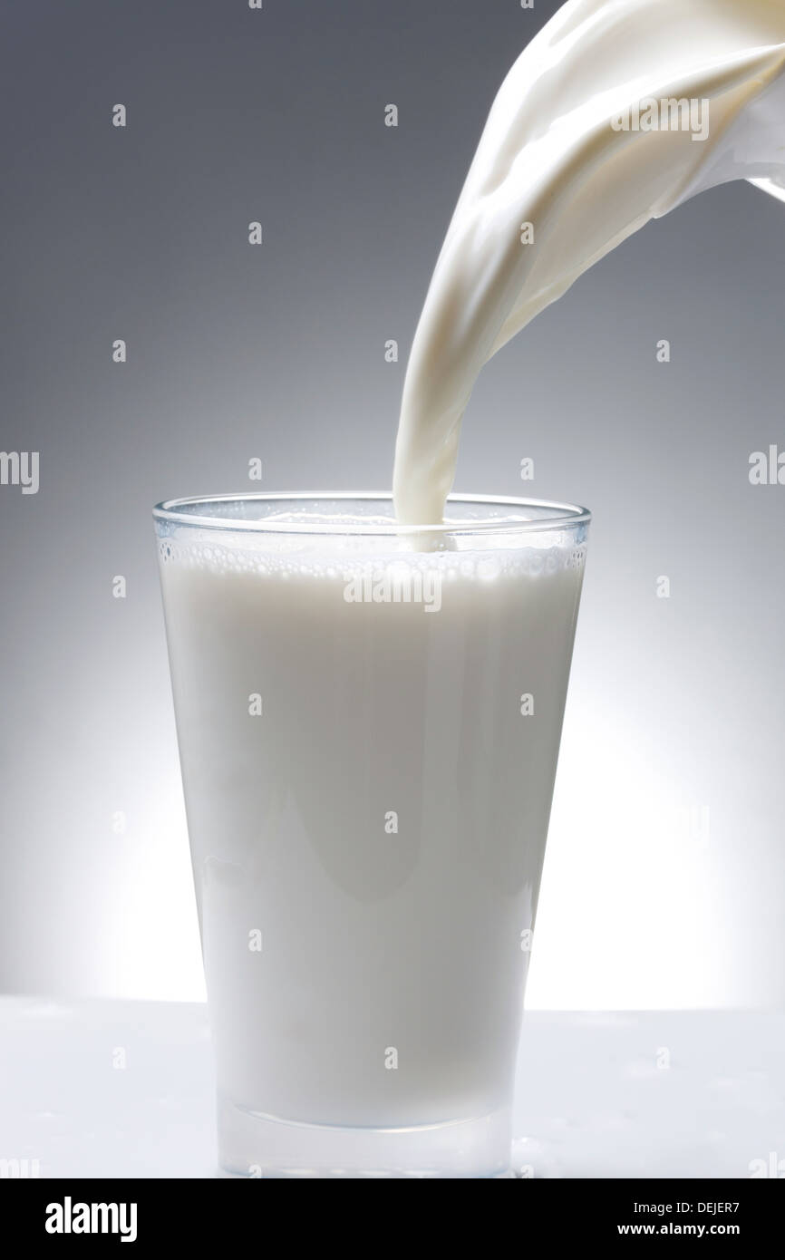 Pouring milk out milk jug hi-res stock photography and images - Alamy