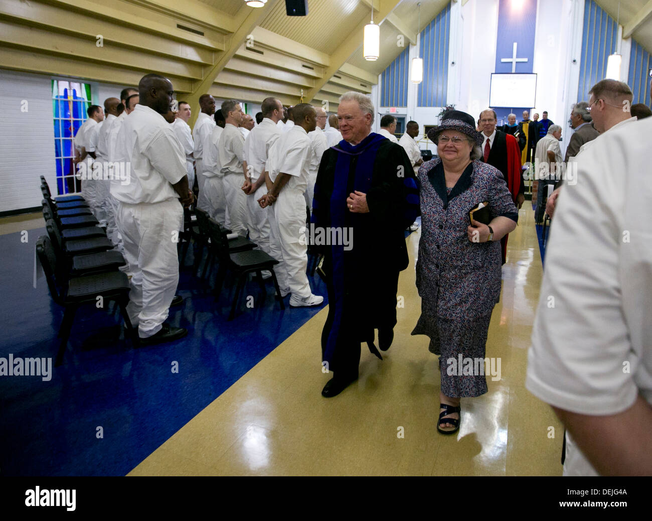 Inmates pray, sing and listen to lecture during convocation ceremony at ...
