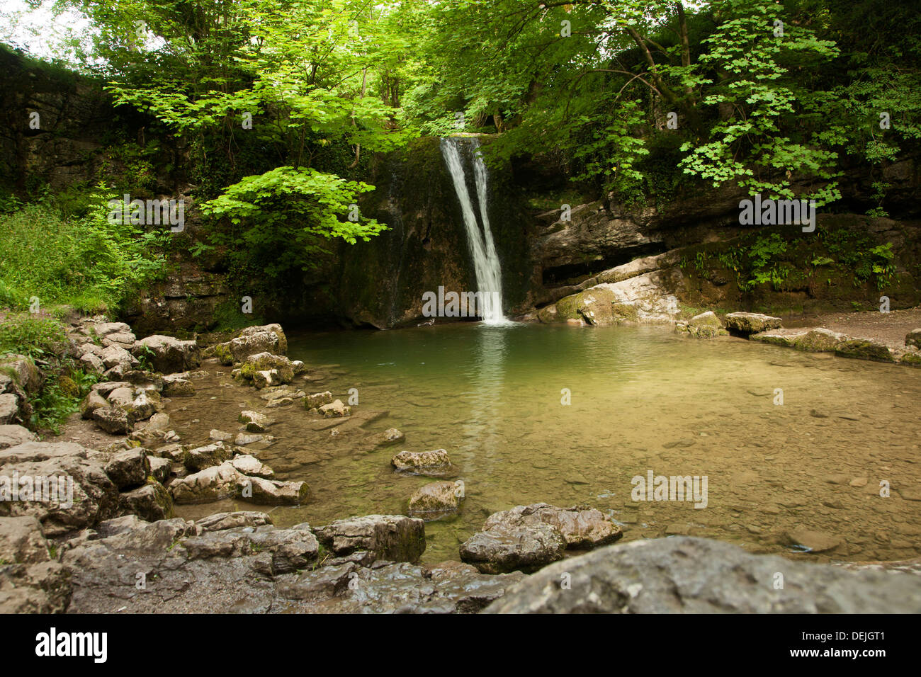 Janet's Foss waterfall falling into a still pool Stock Photo - Alamy