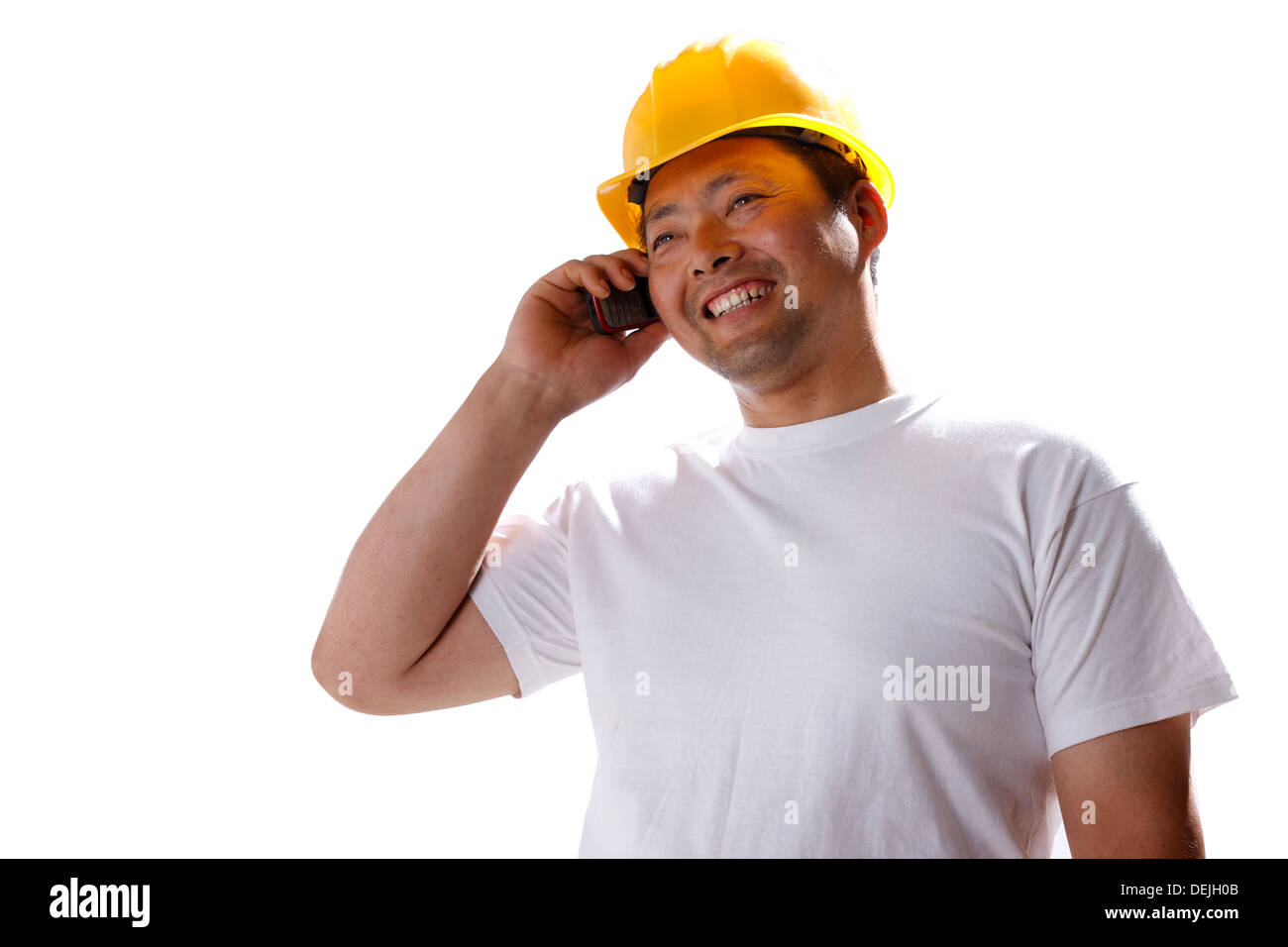 Building worker making phone call Stock Photo - Alamy