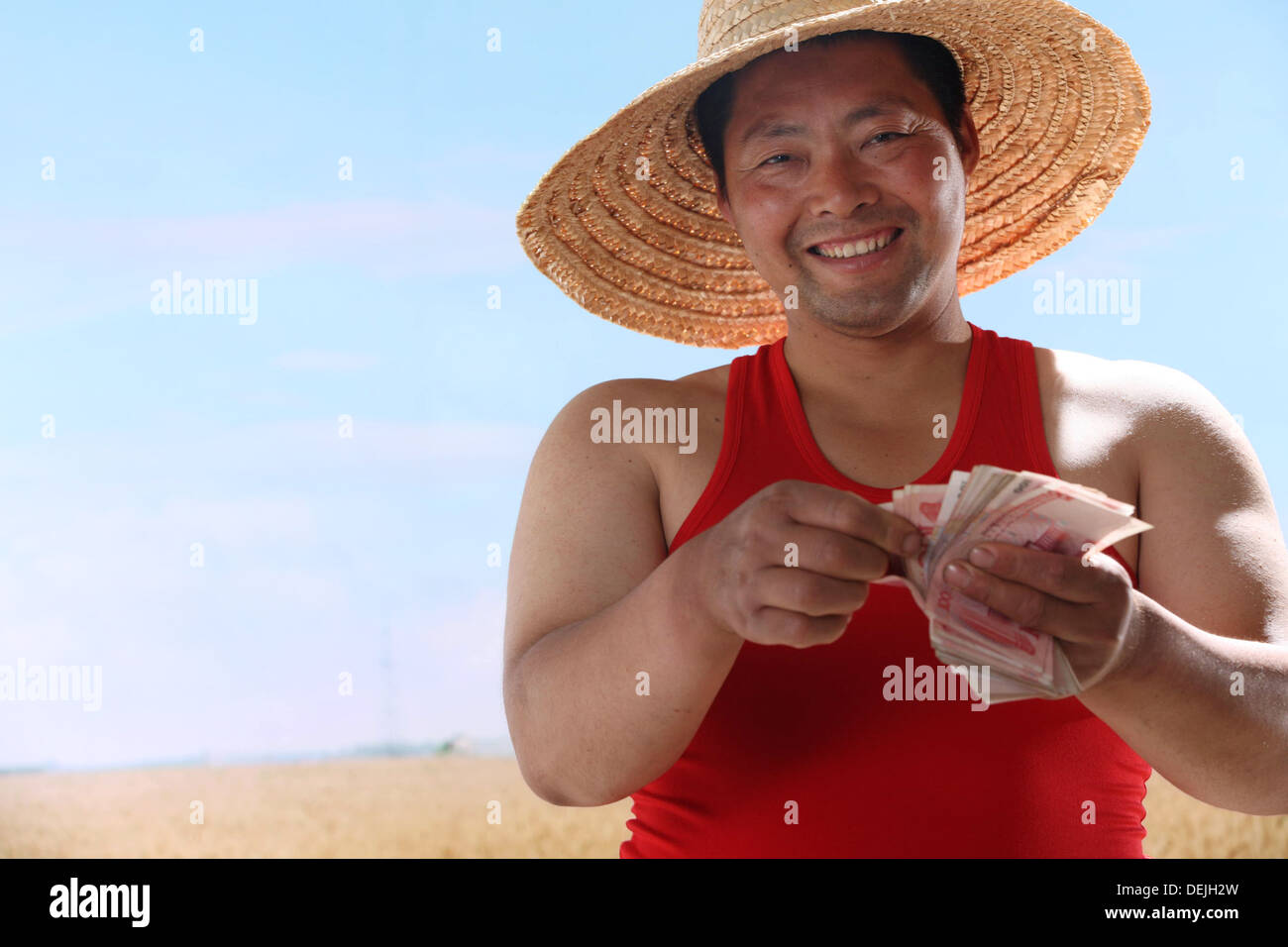 Farmer counting money in field hi-res stock photography and images - Alamy