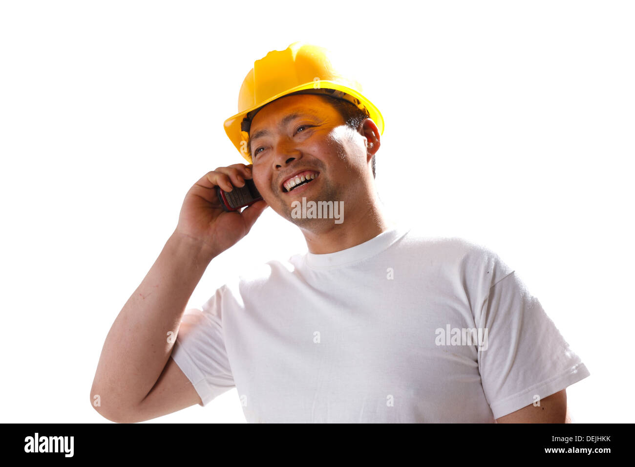 Building worker making phone call Stock Photo - Alamy