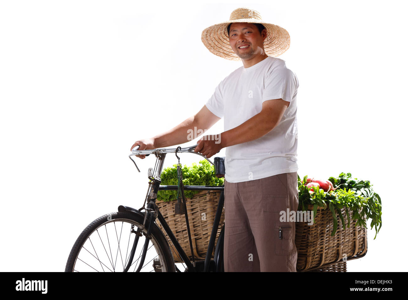 Farmer walking bike with vegetable Stock Photo - Alamy