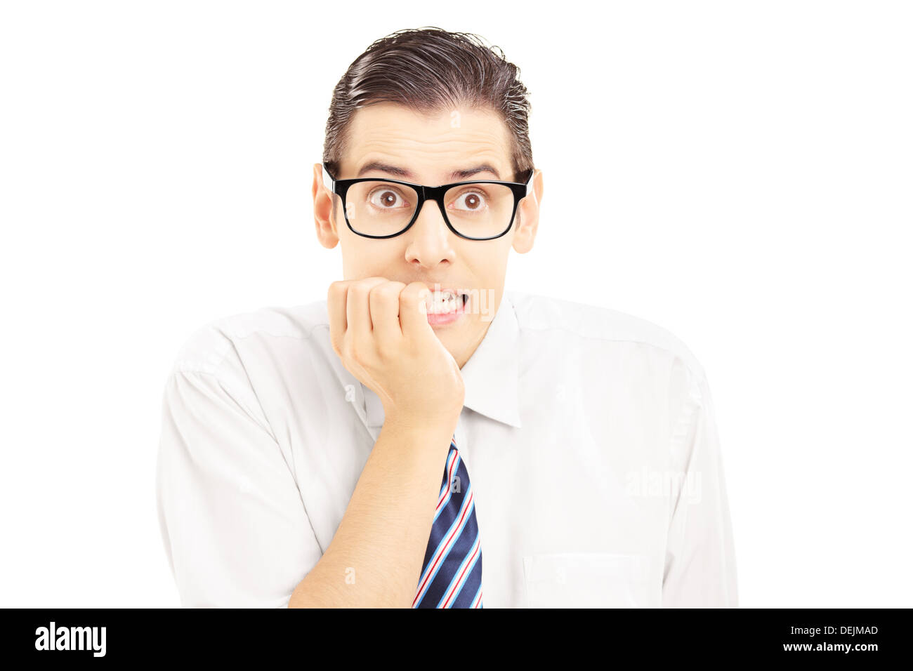 Frightened young man looking at camera Stock Photo - Alamy