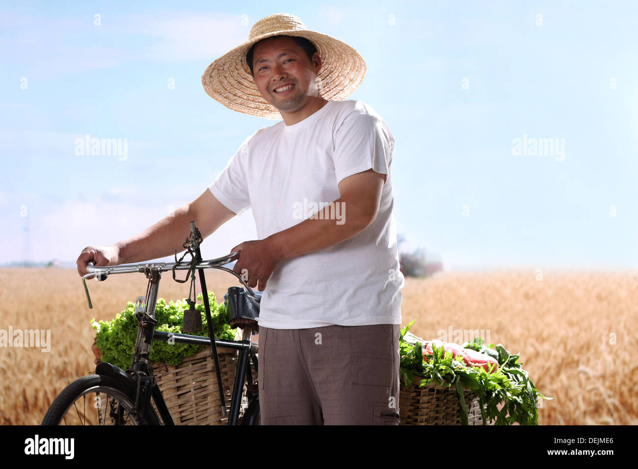 Farmer walking bike with vegetable Stock Photo - Alamy
