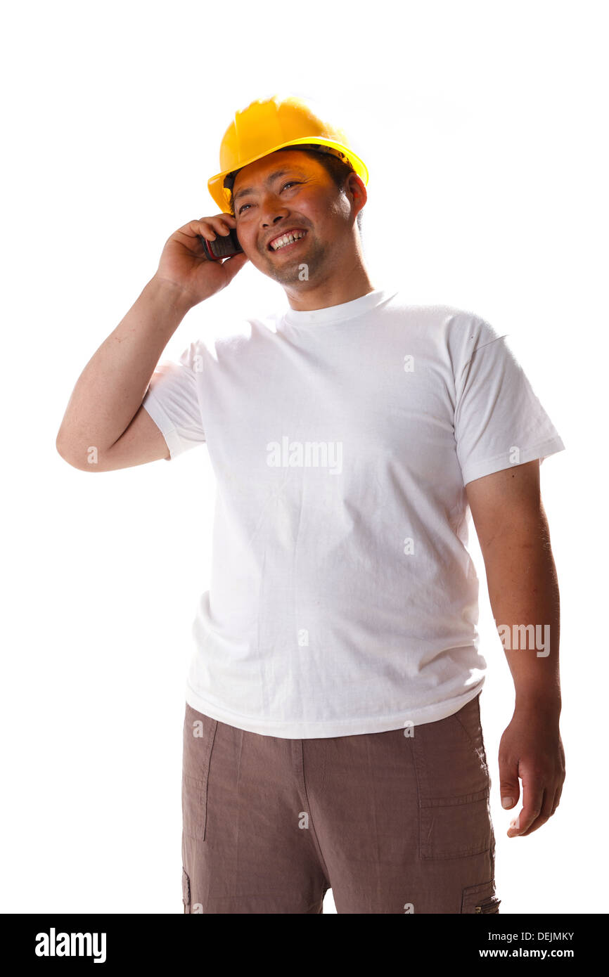 Building worker making phone call Stock Photo - Alamy