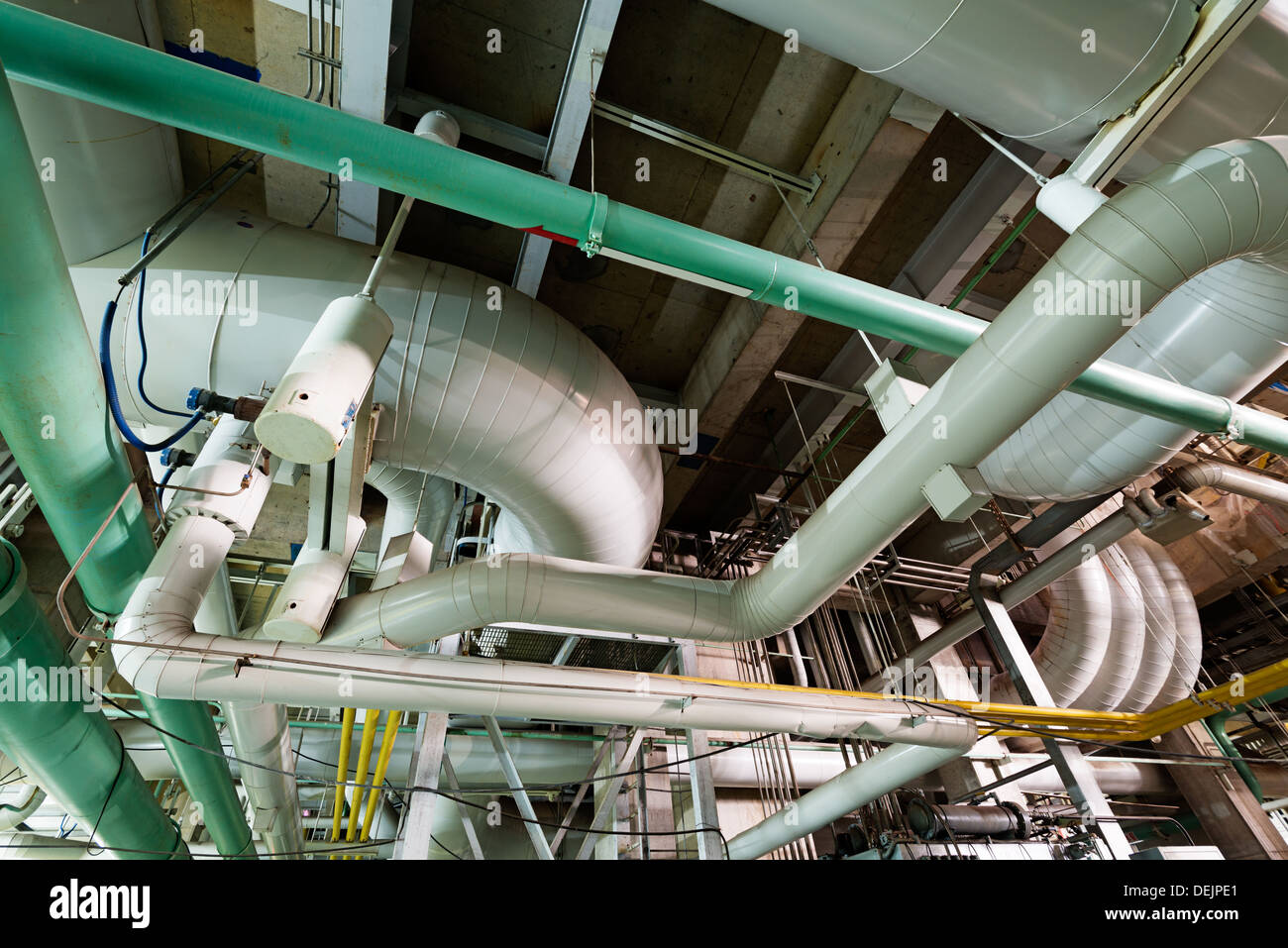 Equipment, cables and piping as found inside of industrial power plant ...