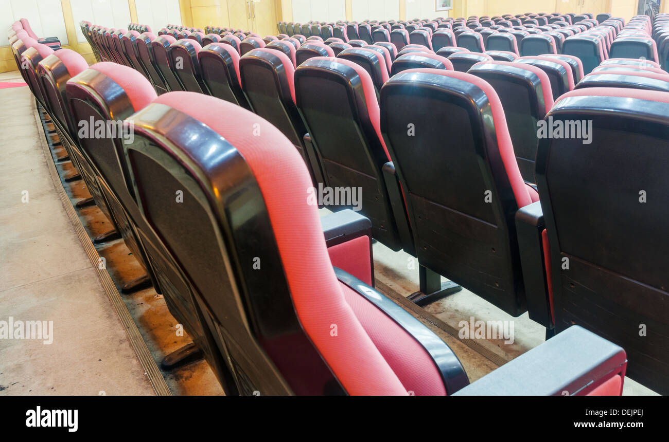 Empty hall for presentation with red armchairs Stock Photo - Alamy