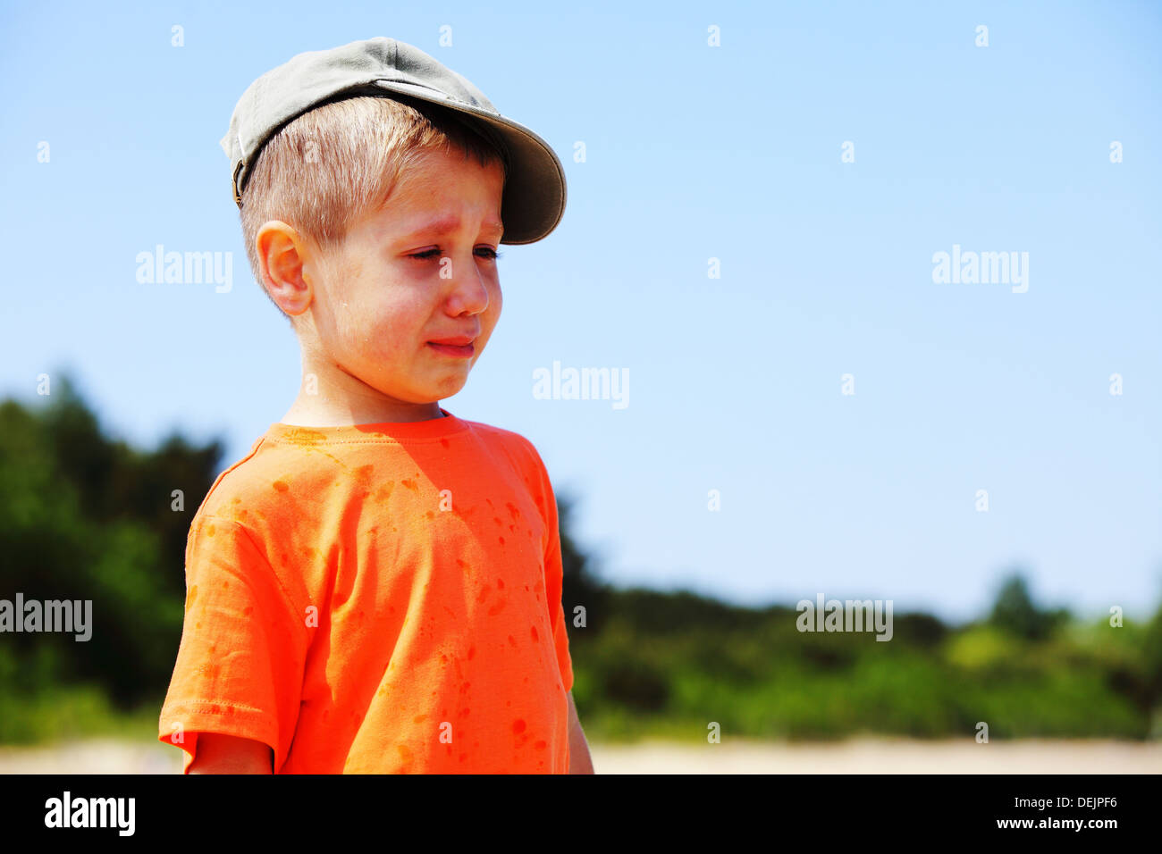Sad child. Portrait of crying unhappy little boy outdoor Stock Photo ...