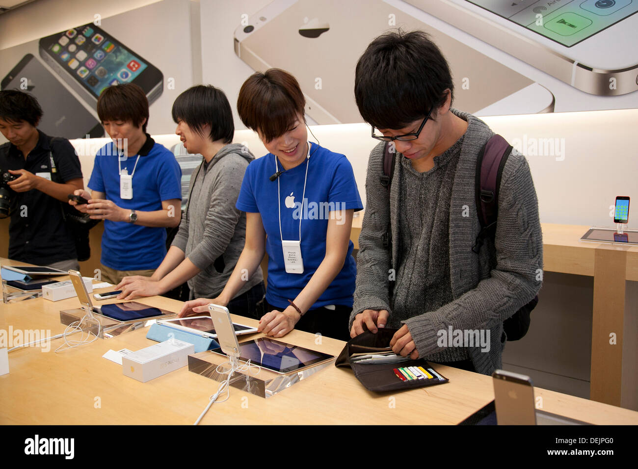 Tokyo, Japan. 20th Sept, 2013. Customers can try out new features of ...