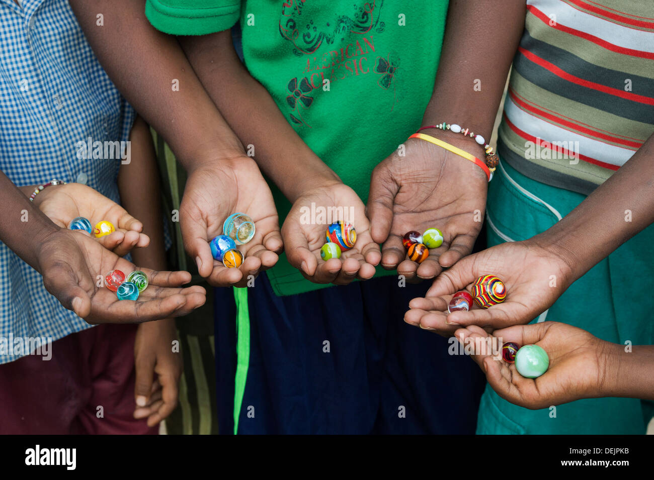 Indian boys hands holding marbles. India Stock Photo - Alamy