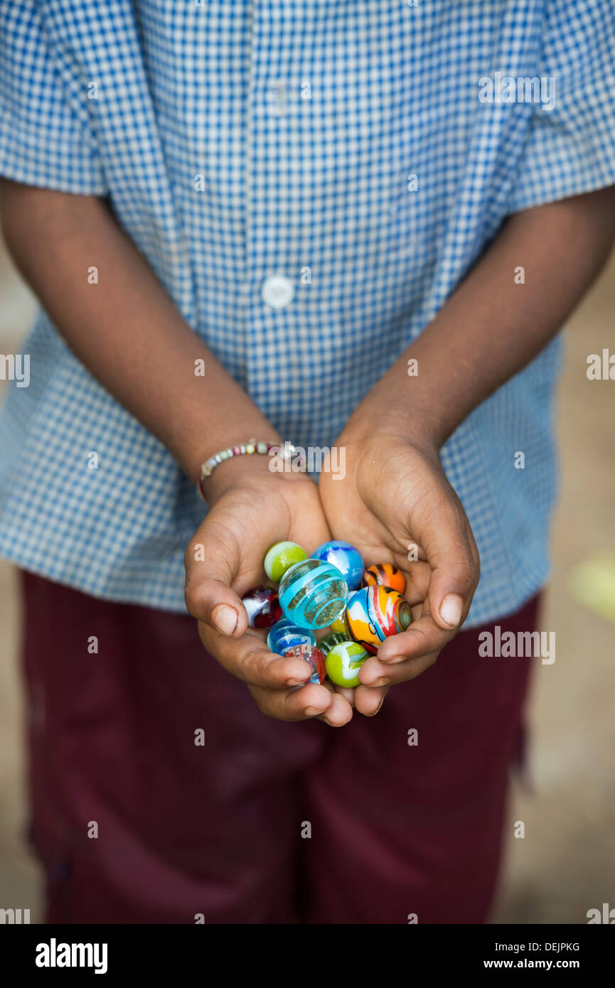 Hand holding marbles hi-res stock photography and images - Alamy