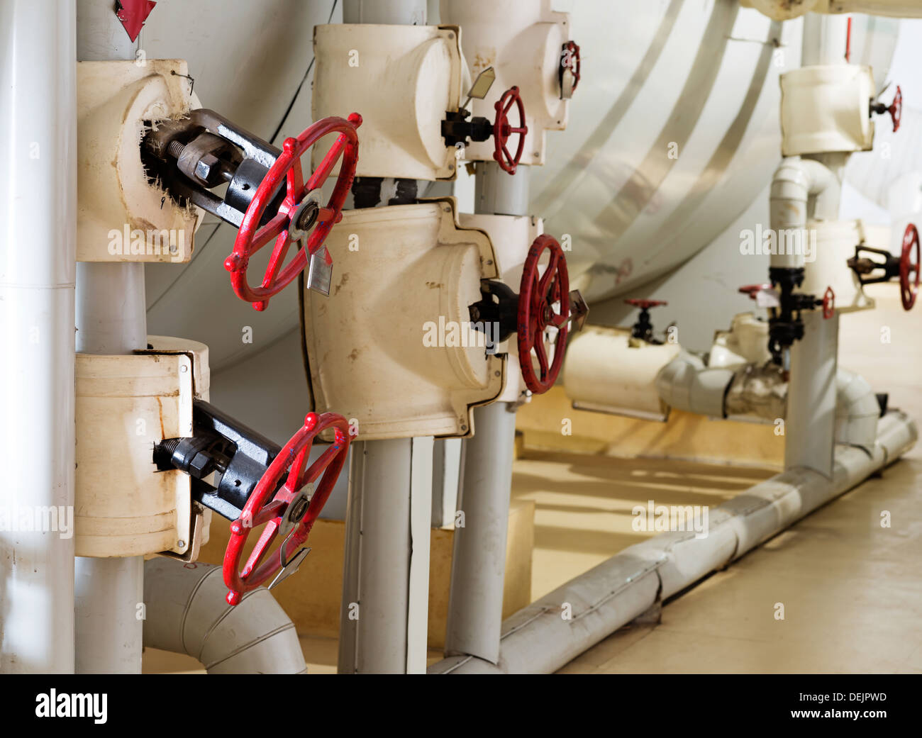 Closeup of manometer, pipes and faucet valves of heating system in a ...