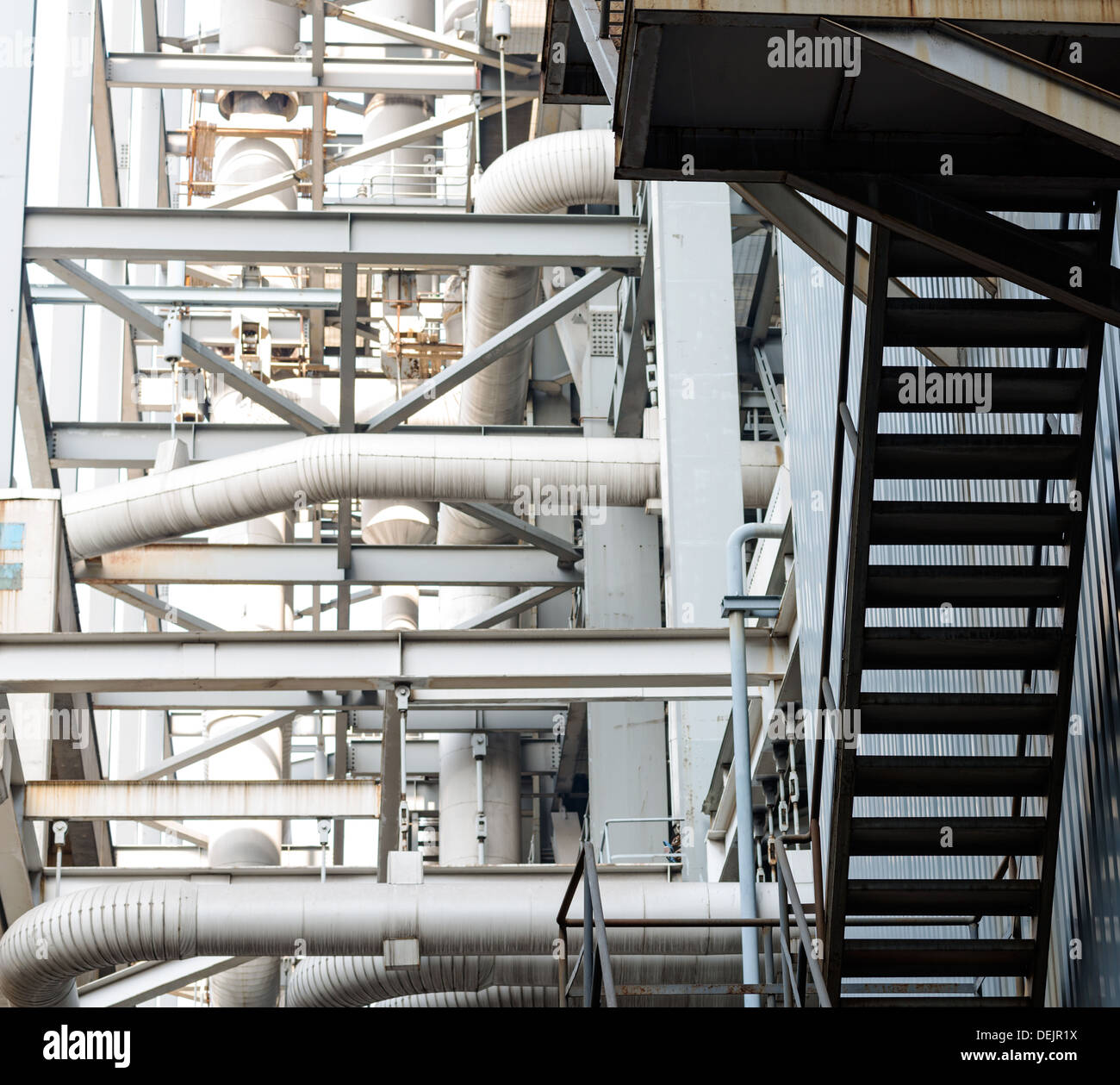 Equipment, cables and piping as found inside of industrial power plant ...