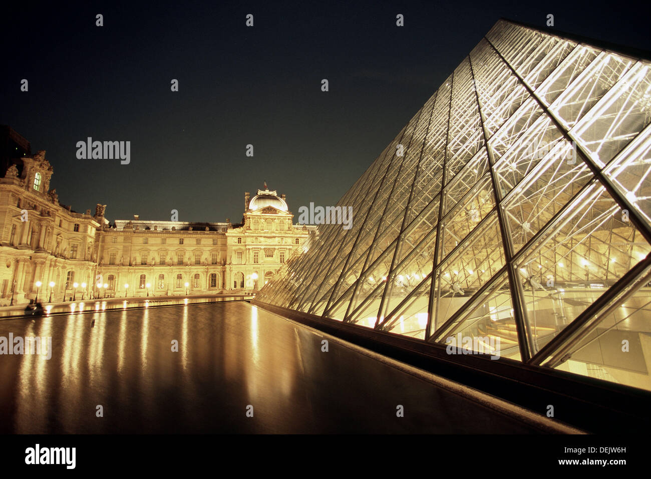 Pyramid of the Grand Louvre art museum and Cour Napoleon by night ...